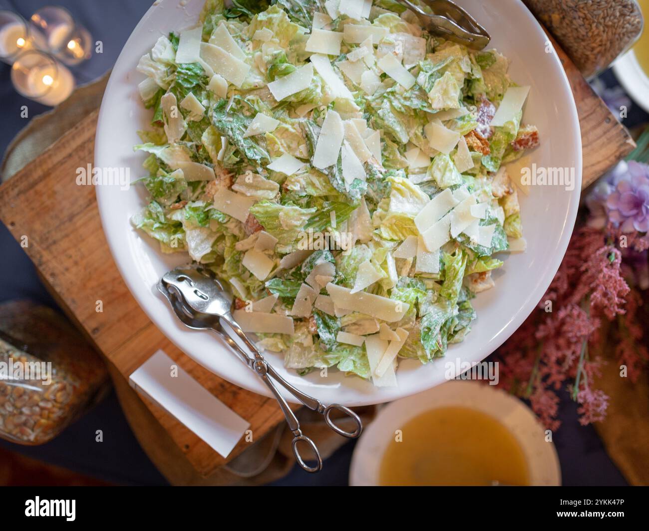Overhead Food Bowl of Caesar Salad with Tongs and Shaved Parmesan ...