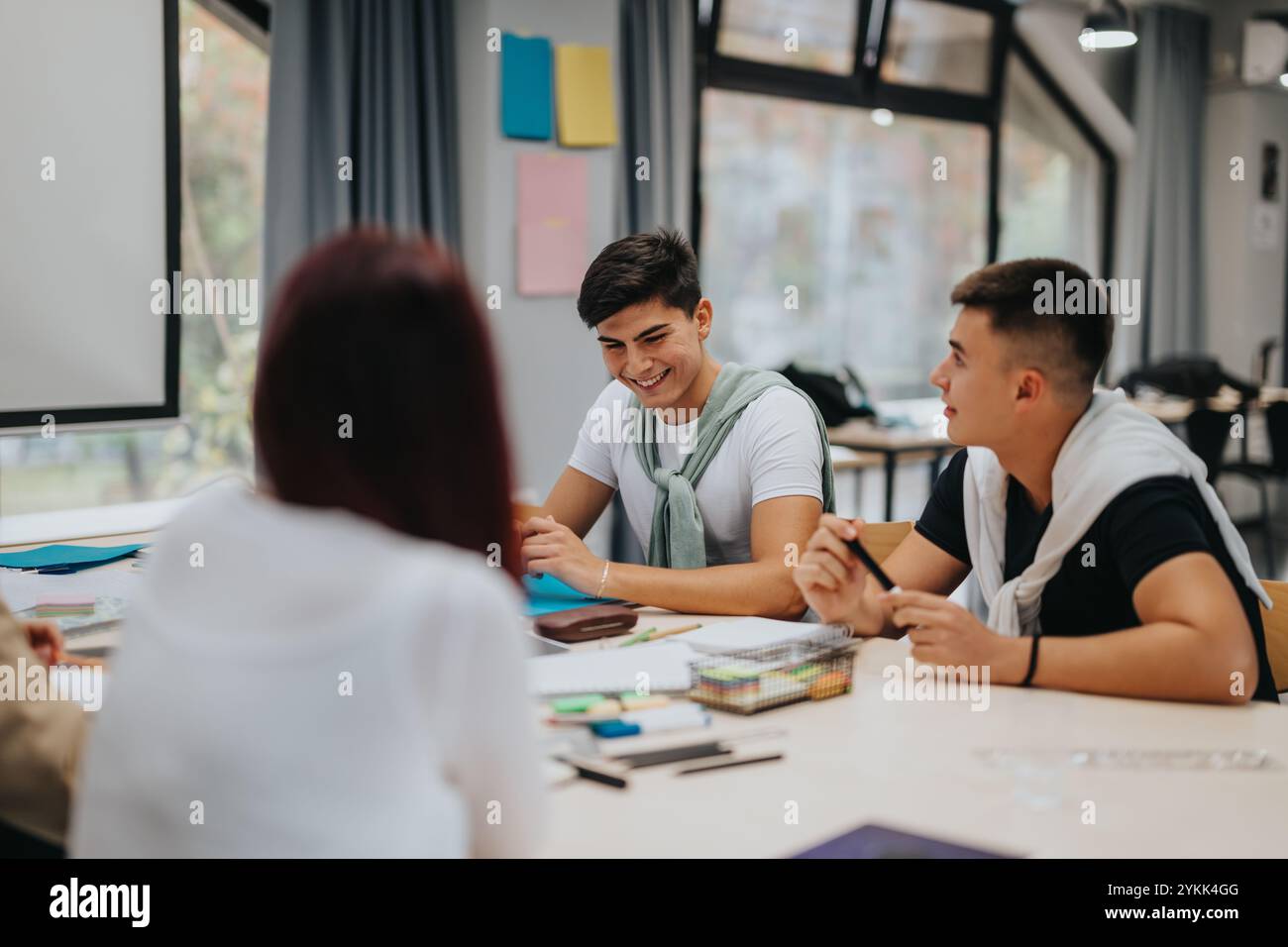 Students engaging in a collaborative group study session at school Stock Photo - Alamy