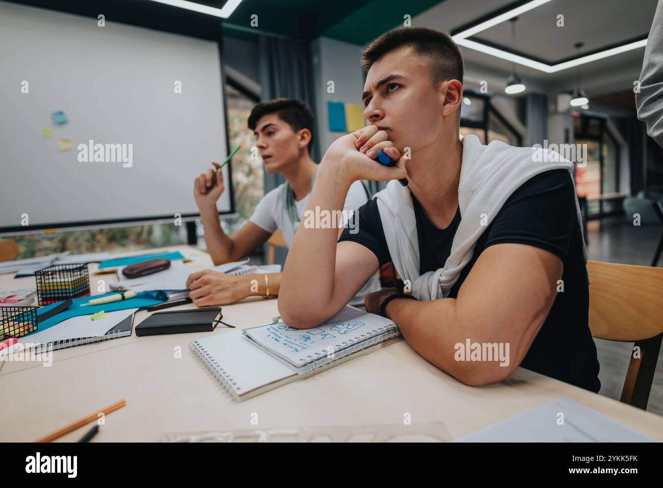 Focused students in a modern classroom setting during a lesson Stock ...