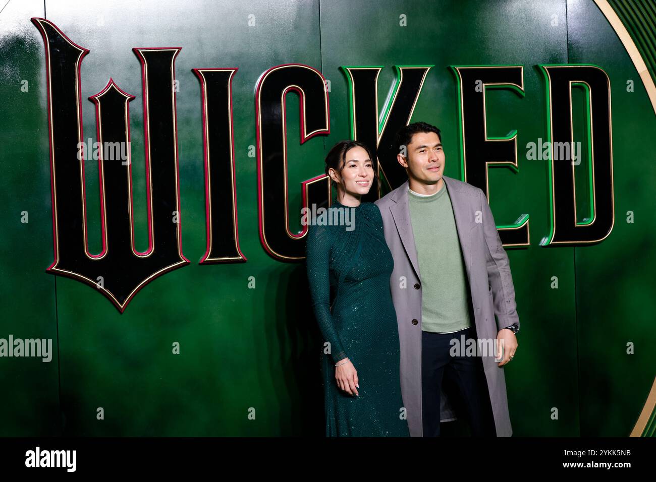 Liv Golding, left, and Henry Golding pose for photographers upon ...