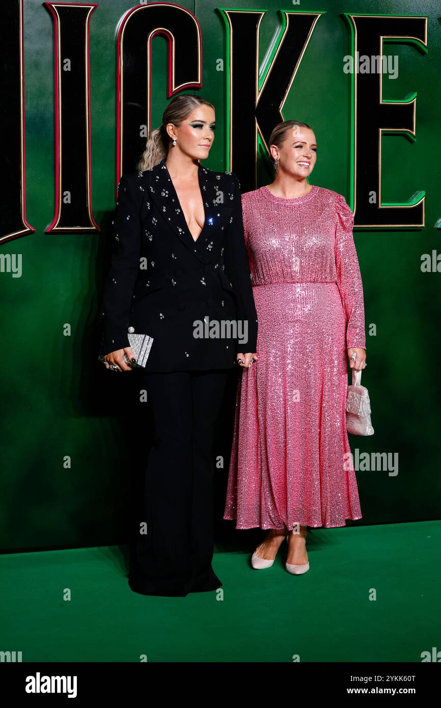 Lucie Jones, left, and Helen Woolf pose for photographers upon arrival ...