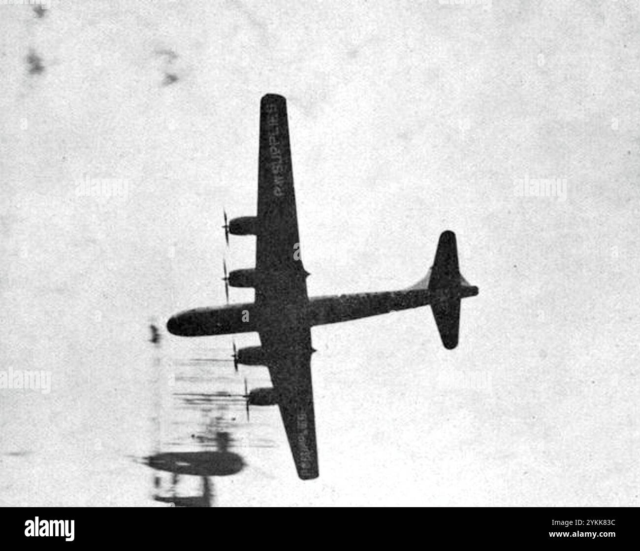 Boeing B-29 Superfortress on supply mission flies over Nagasaki, Japan ...