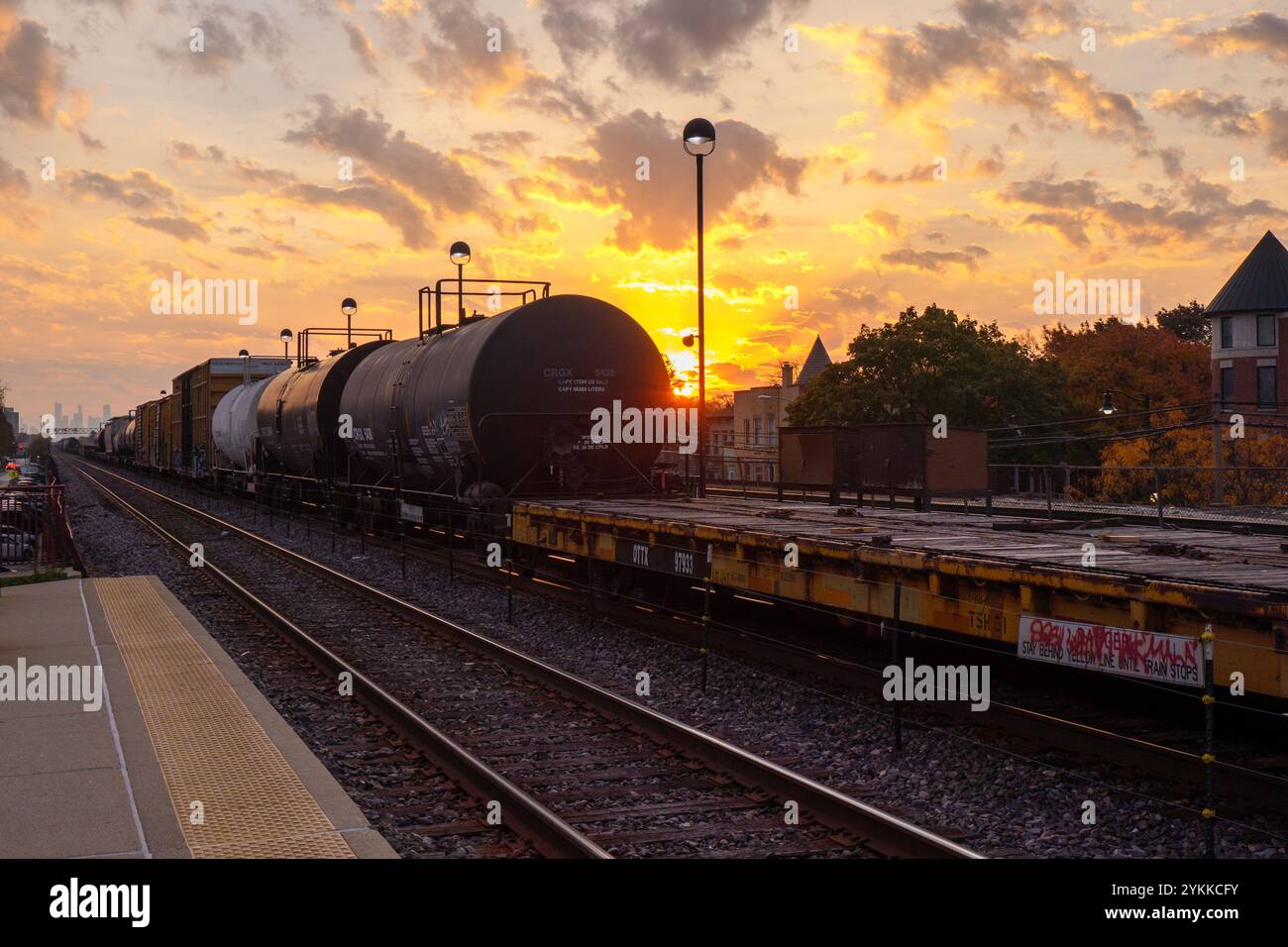 Freight train at sunrise parked at the Oak Park Metra Station with ...