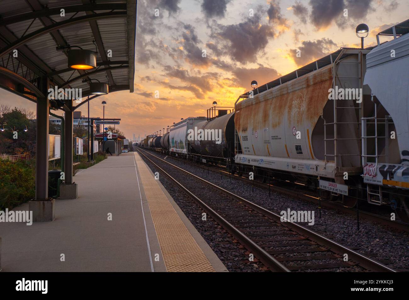 Freight train at sunrise parked at the Oak Park Metra Station with ...