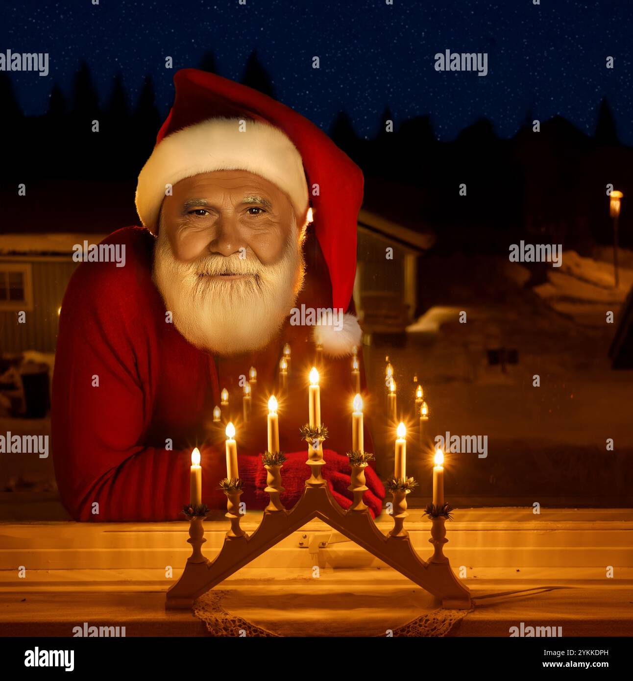 Santa Claus stands outside the window and looks into the room with a ...