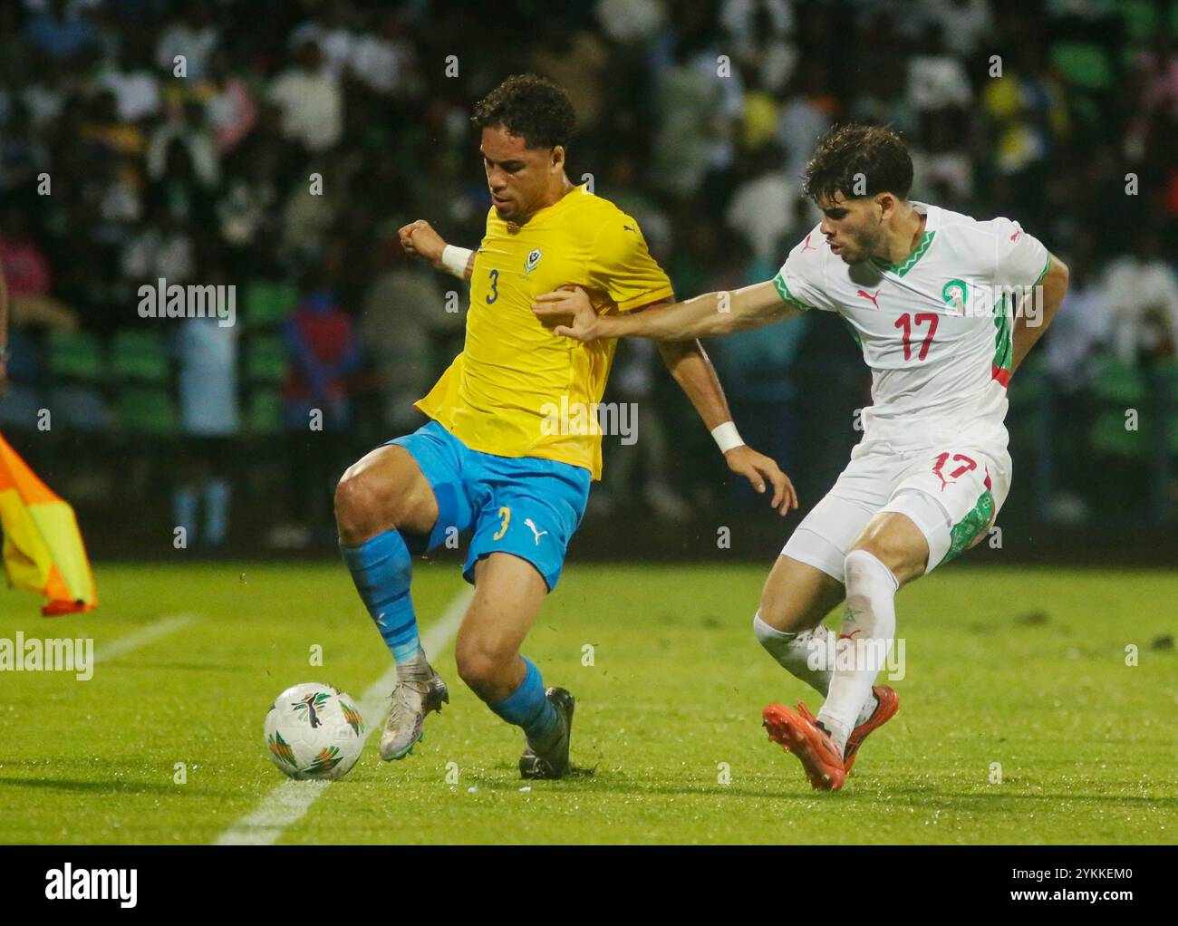 FRANCEVILLE, GABON - NOVEMBER 15: Anthony Oyono of Gabon and Abdessamad ...