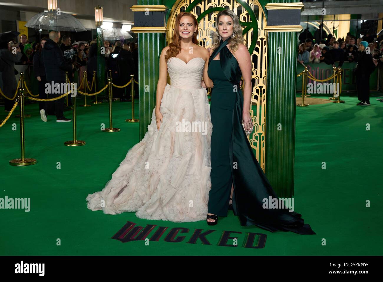 Sophie Evans, left, and Alice Fearn pose for photographers upon arrival ...