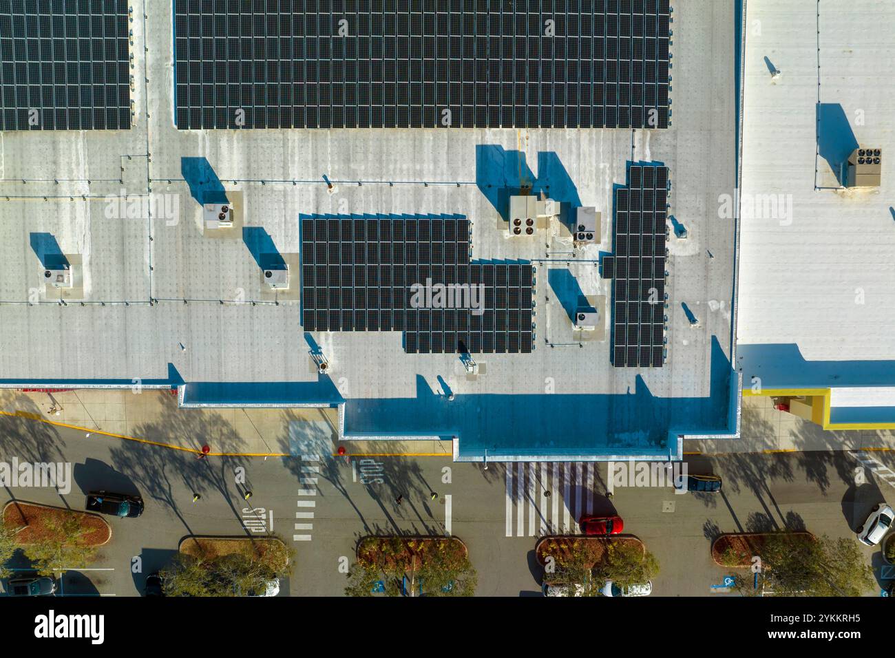 Aerial view of blue photovoltaic solar panels mounted on industrial ...