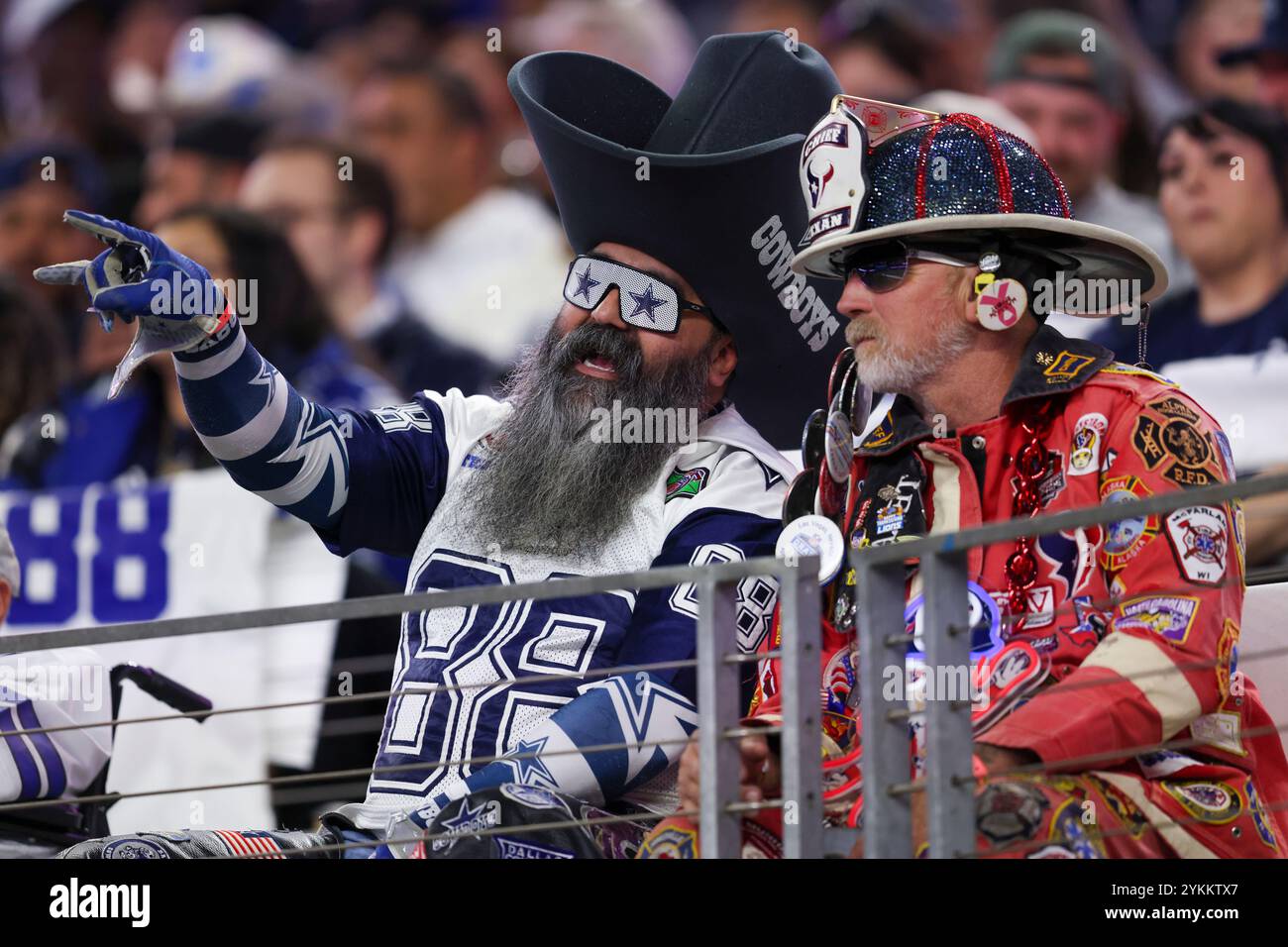 Spectators look on during the first half of an NFL football game ...
