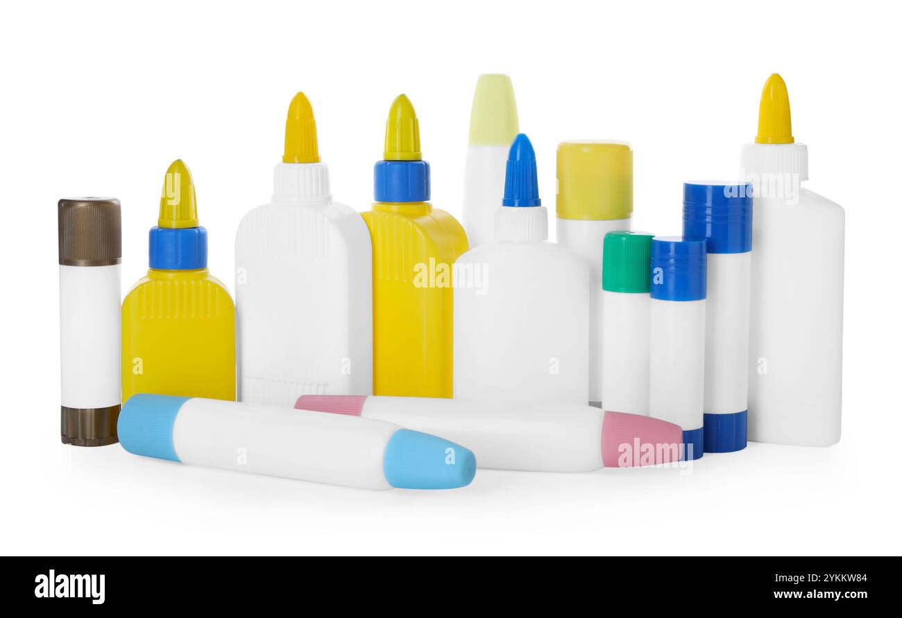 Bottles and sticks of glue on white background Stock Photo - Alamy