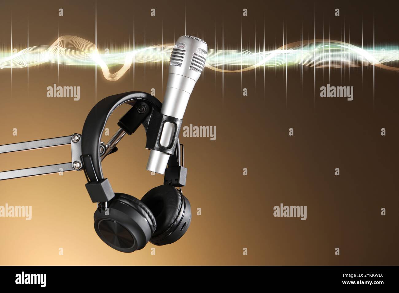 Sound wave, microphone and headphones on brown gradient background ...