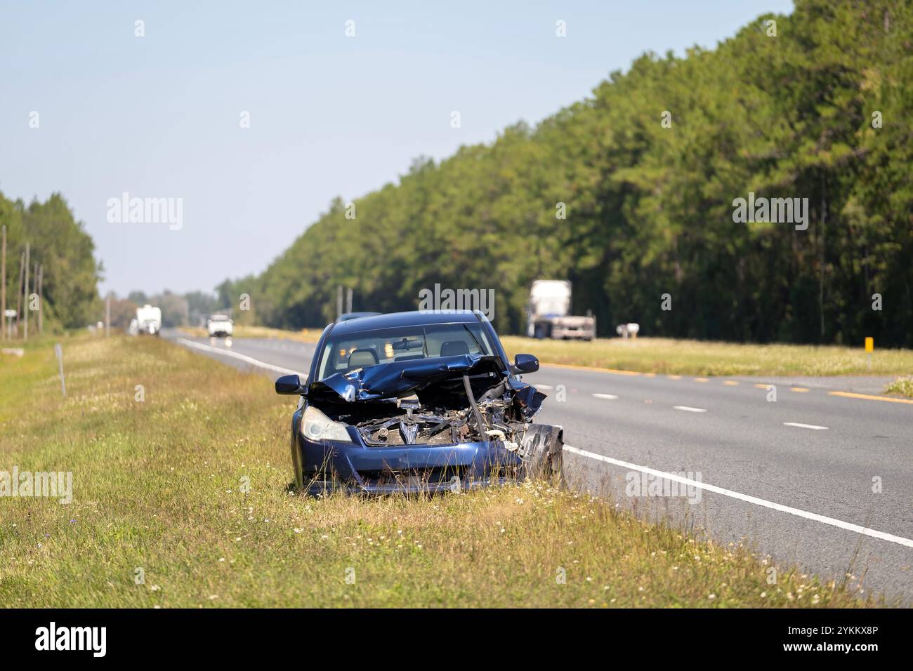 Dented car damaged after traffic accident parked on highway roadside ...