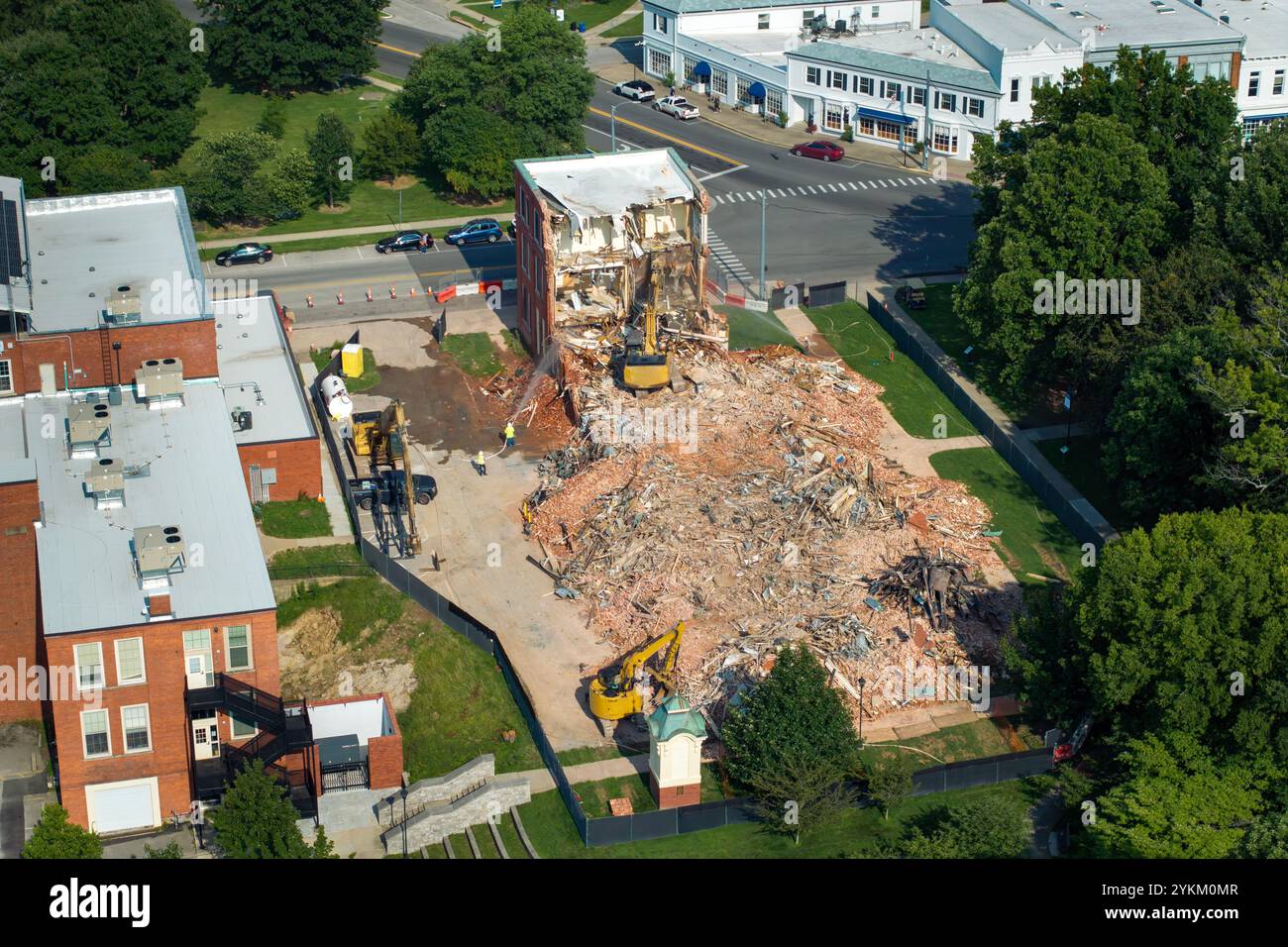 Old building demolition site. Construction excavator tearing down ...