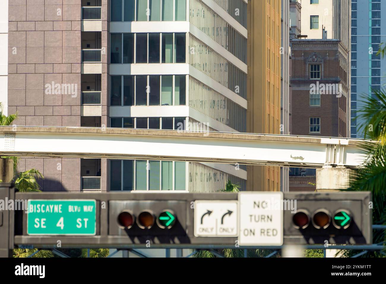 Traffic lights regulating driving cars on city street in Miami, Florida ...