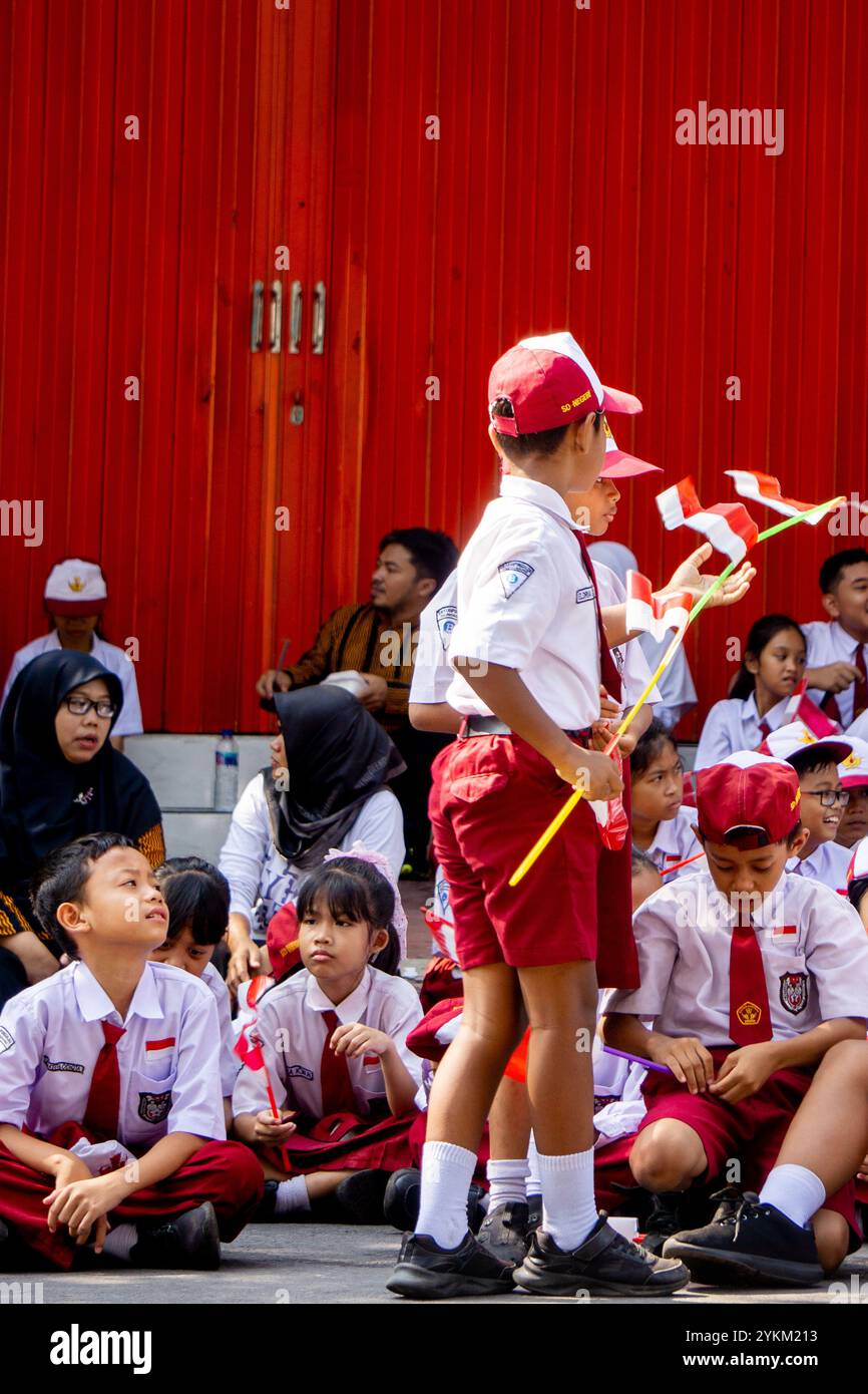 Indonesian elementary school students with uniform bring indonesian ...