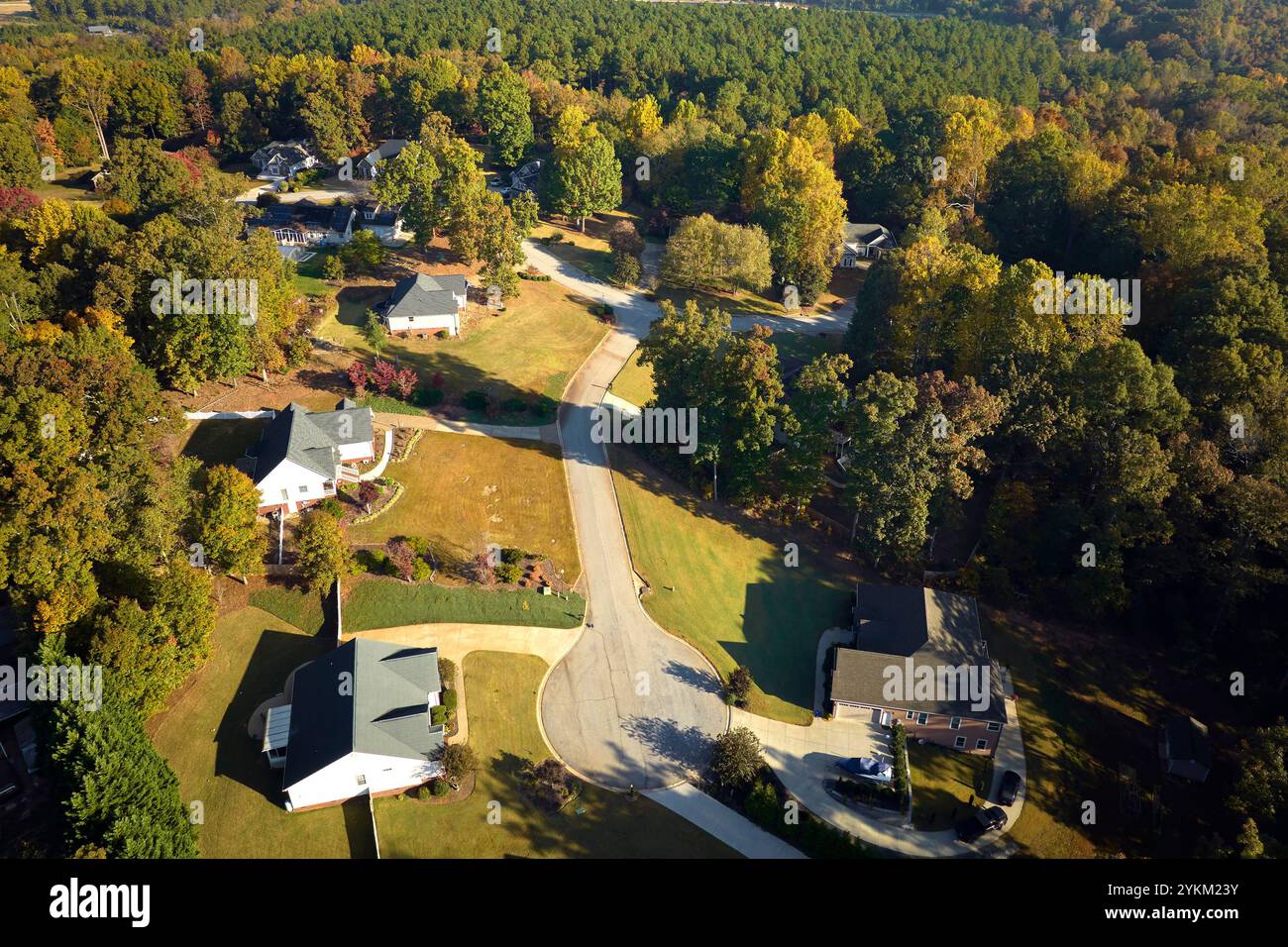 View from above of expensive residential houses between yellow fall ...