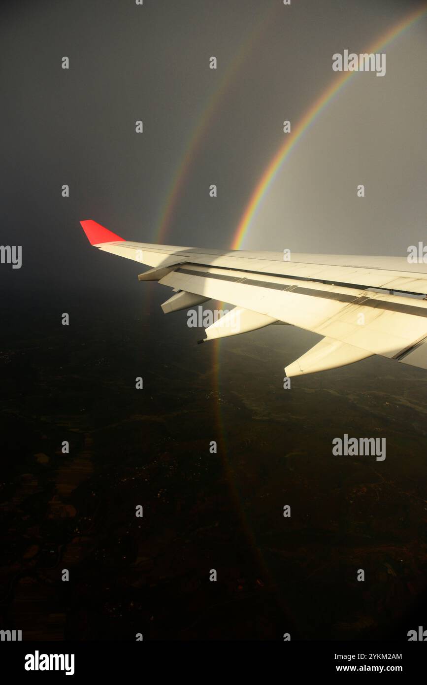 A double rainbow seen from an Air Mauritius plane flying over Madagascar Stock Photo - Alamy
