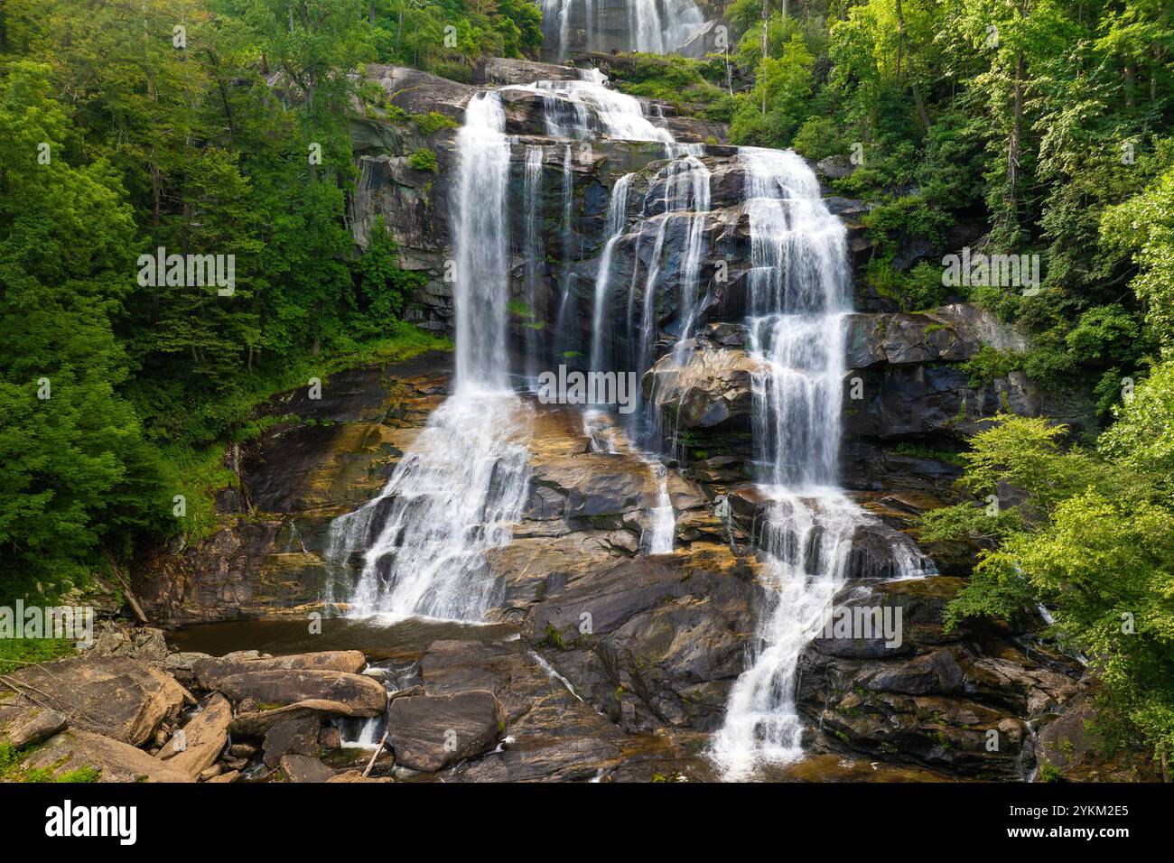 Whitewater Falls with falling down clear water from rocky boulders ...