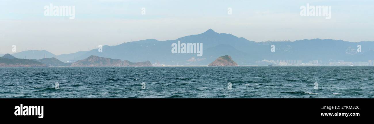 A view of Pak Sha Chau and Crooked island with the Yantian district in ...