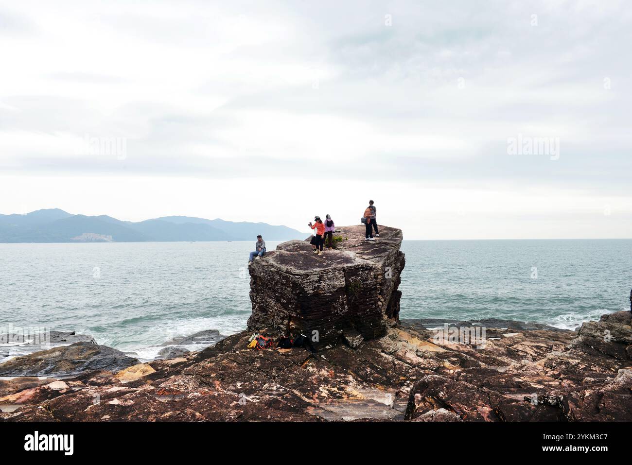 Tourist standing on the beautiful rock at the southern part of Tung ...