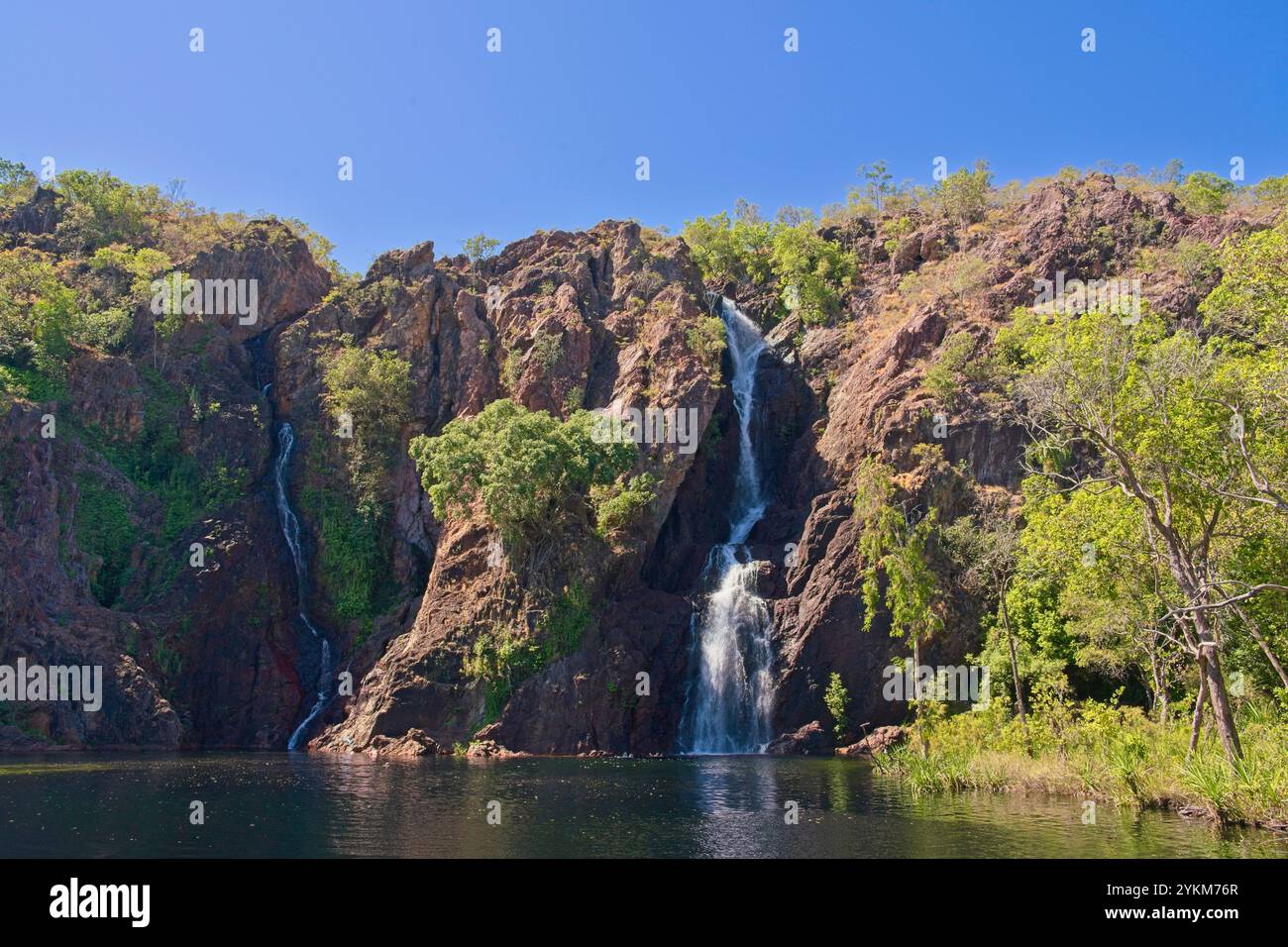The Wangi Falls a popular swimming spot, has two misty waterfalls ...