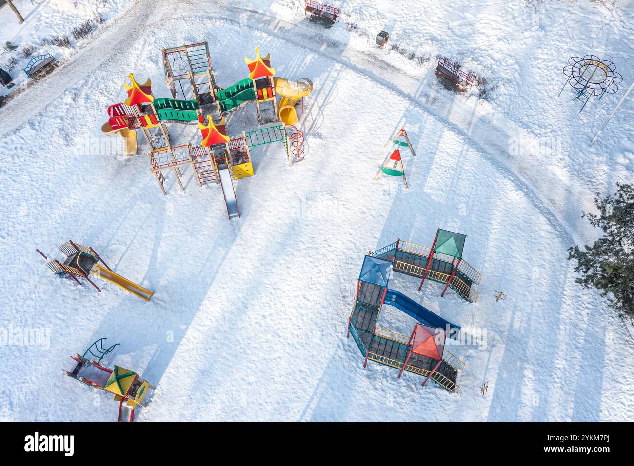 colorful playground in winter park. aerial drone photo on sunny morning ...