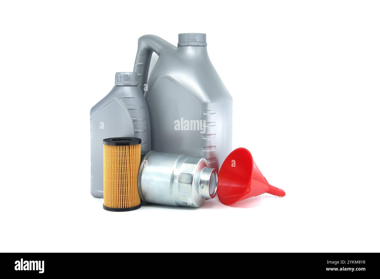 Two oil containers and automotive filters are displayed on a white ...