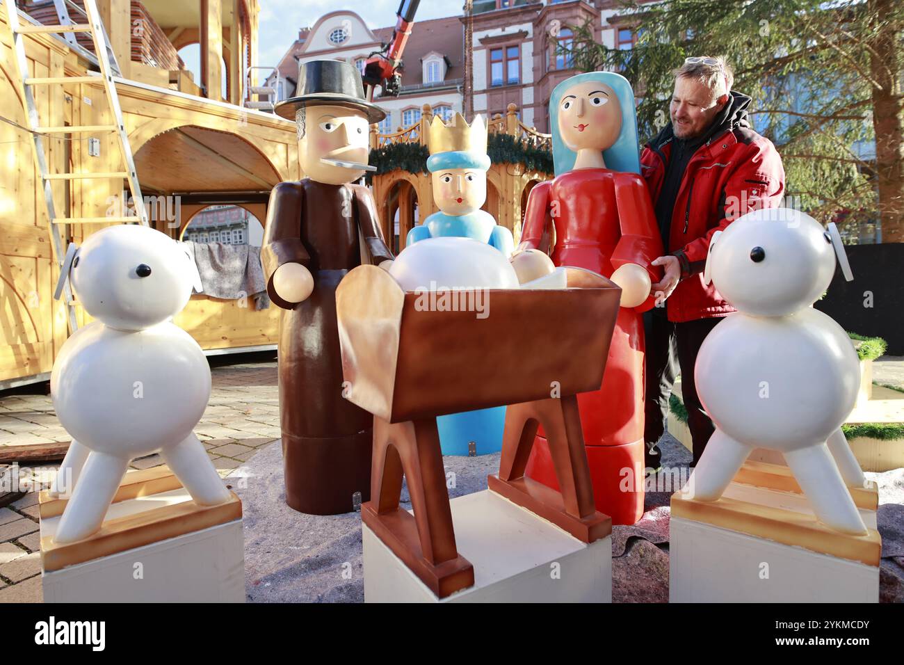 Quedlinburg, Germany. 18th Nov, 2024. Helpers set up figures for a four ...