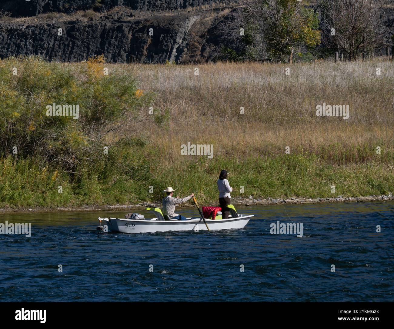 Woman fly fishing in the Missouri River in Montana. She is fishing ...