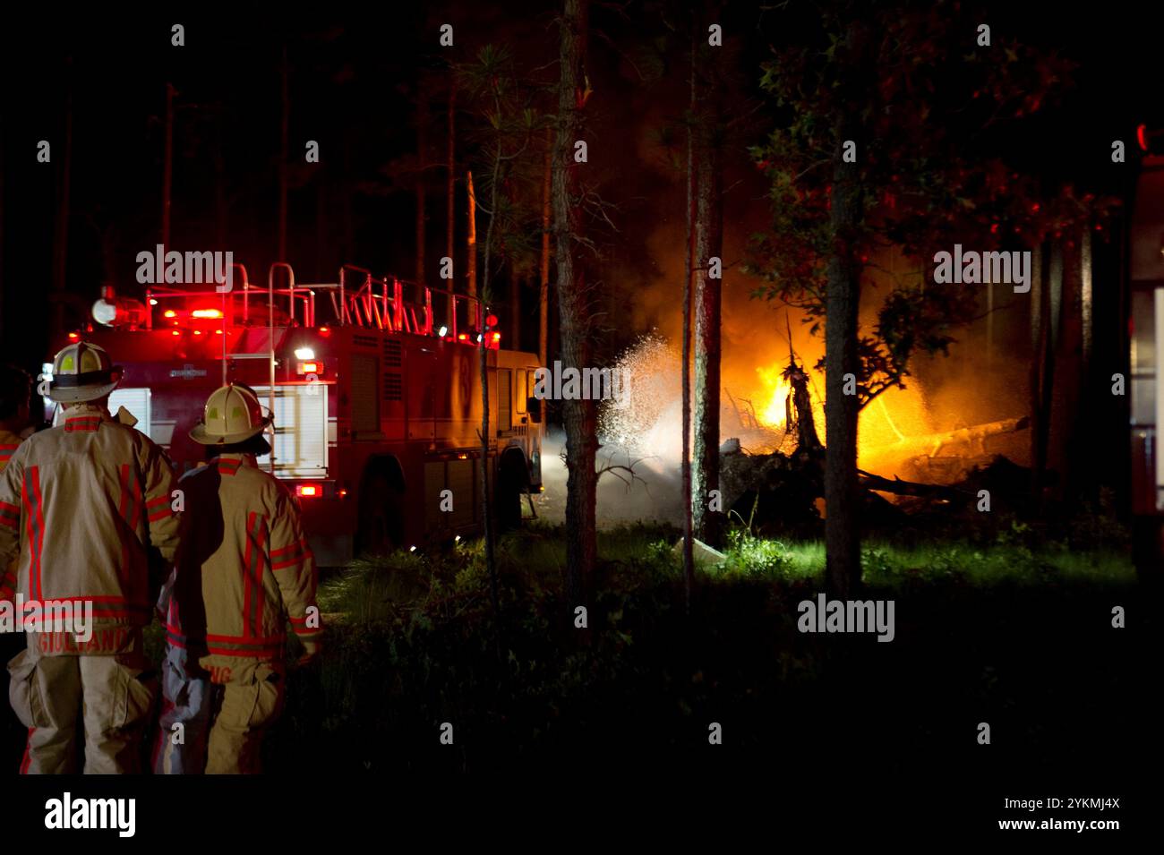 Local emergency responders extinguish the fires caused by a CV-22 ...
