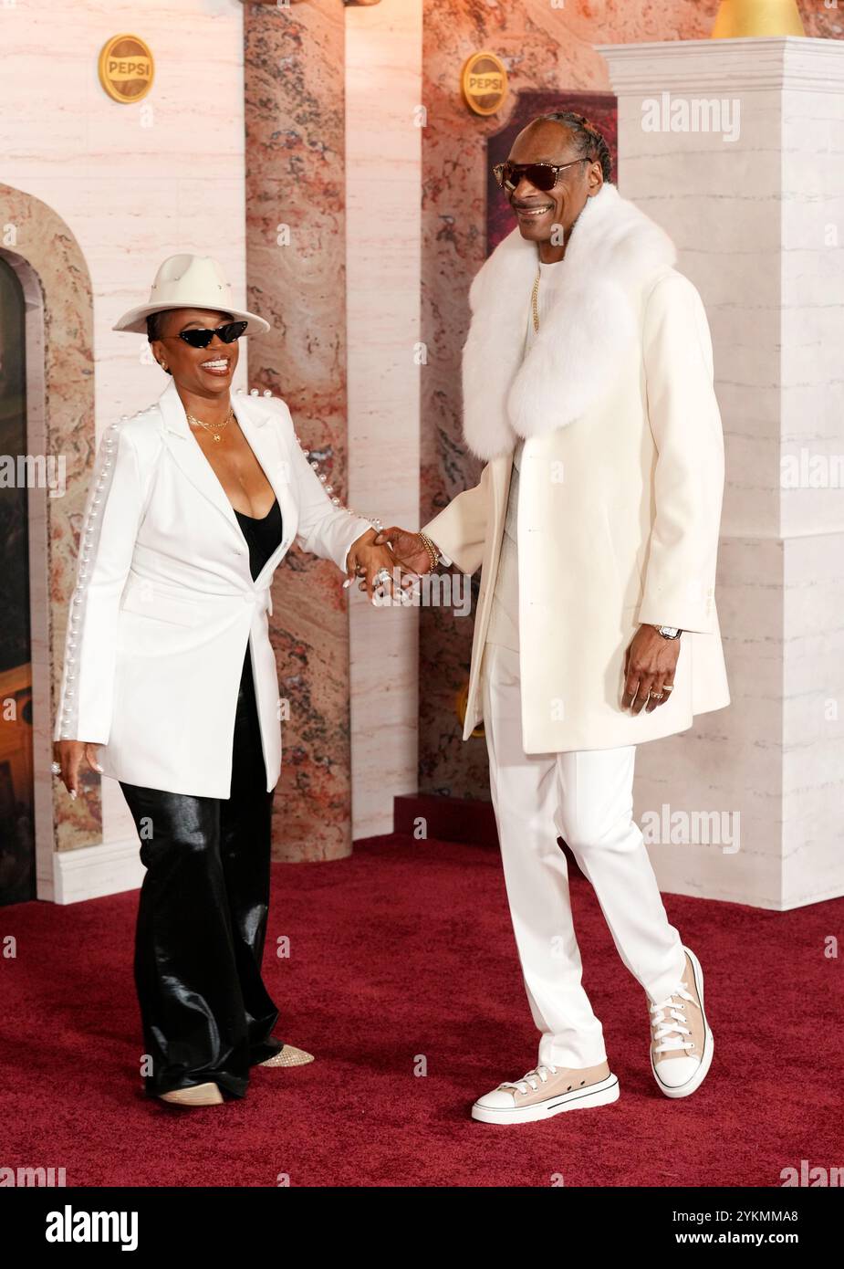 Snoop Dogg, right, and his wife Shante Broadus arrive at the premiere ...