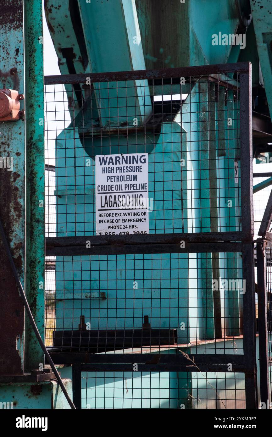 Warning sign high pressure crude oil pipeline on petroleum ...