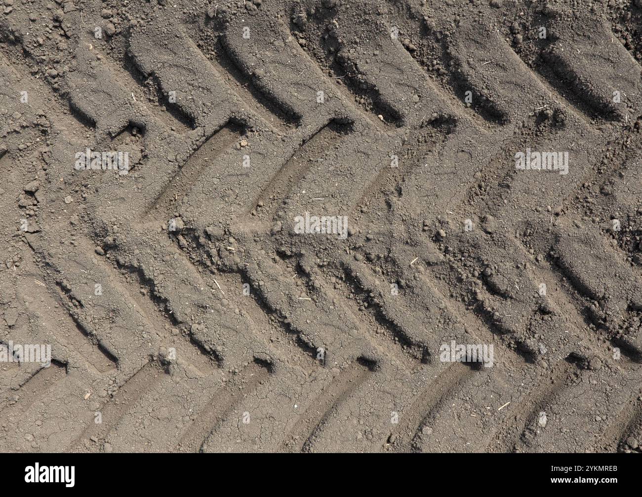 Tyre tread pattern on the ground in the field Stock Photo - Alamy