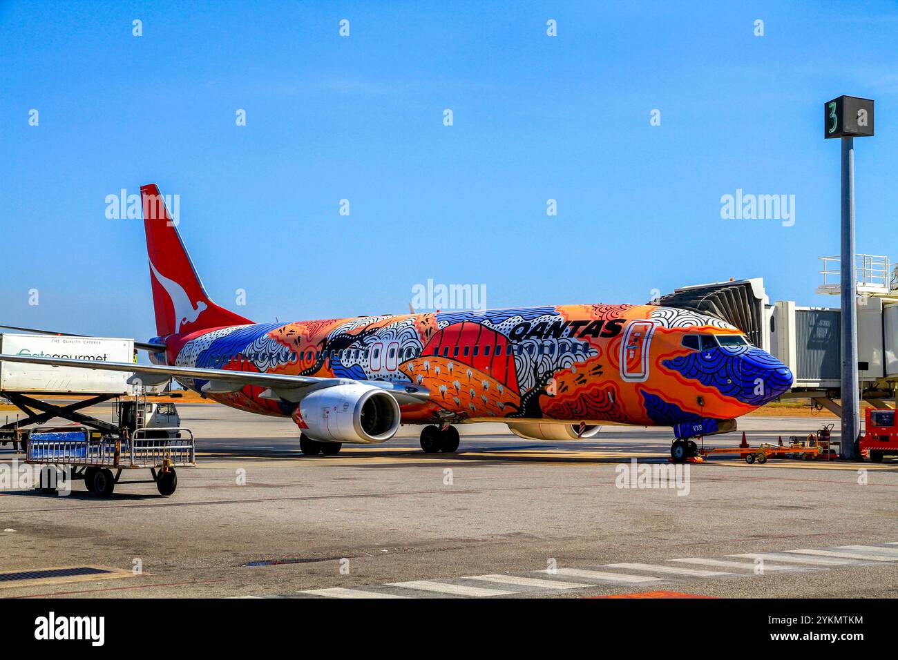 A Qantas aircraft with aboriginal artwork prepares for takeoff at ...