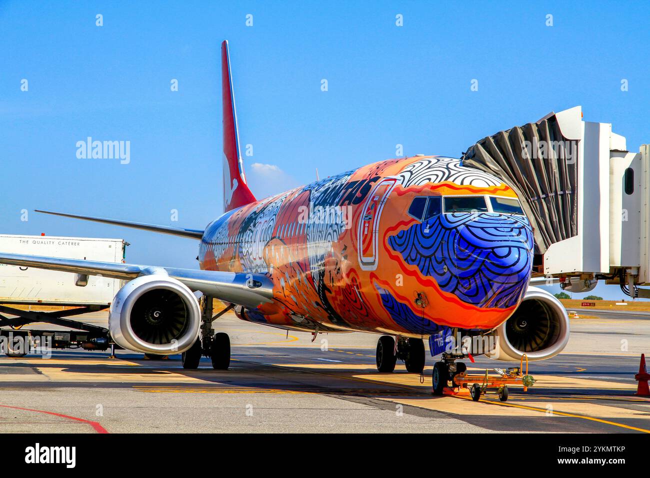 A Qantas aircraft with aboriginal artwork prepares for takeoff at ...