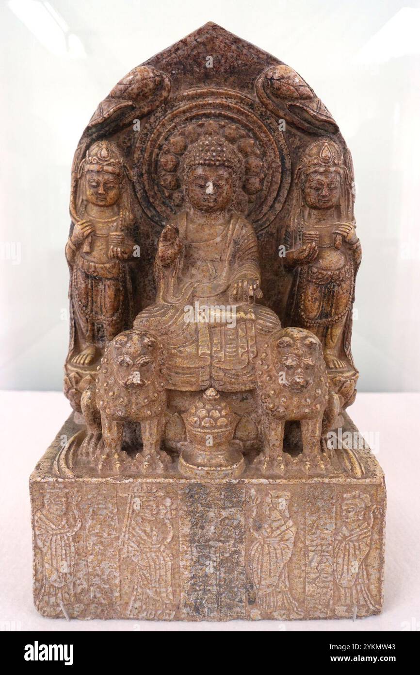 Buddha triad, China, Northern Zhou dynasty, 500s AD, stone Stock Photo ...