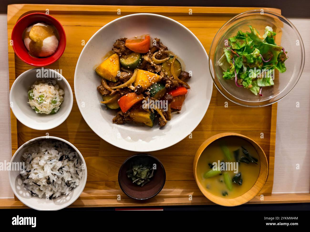 Overhead view of a complete japanese meal arrangement with various ...