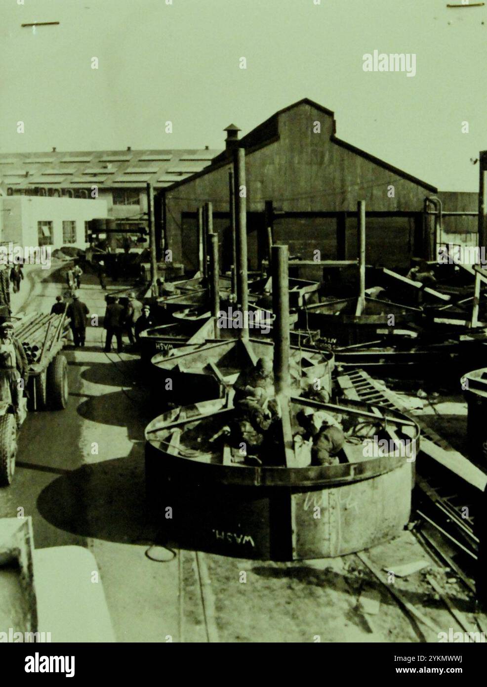 Building machine gun turrets for commercial cargo shipping, WWII Stock ...