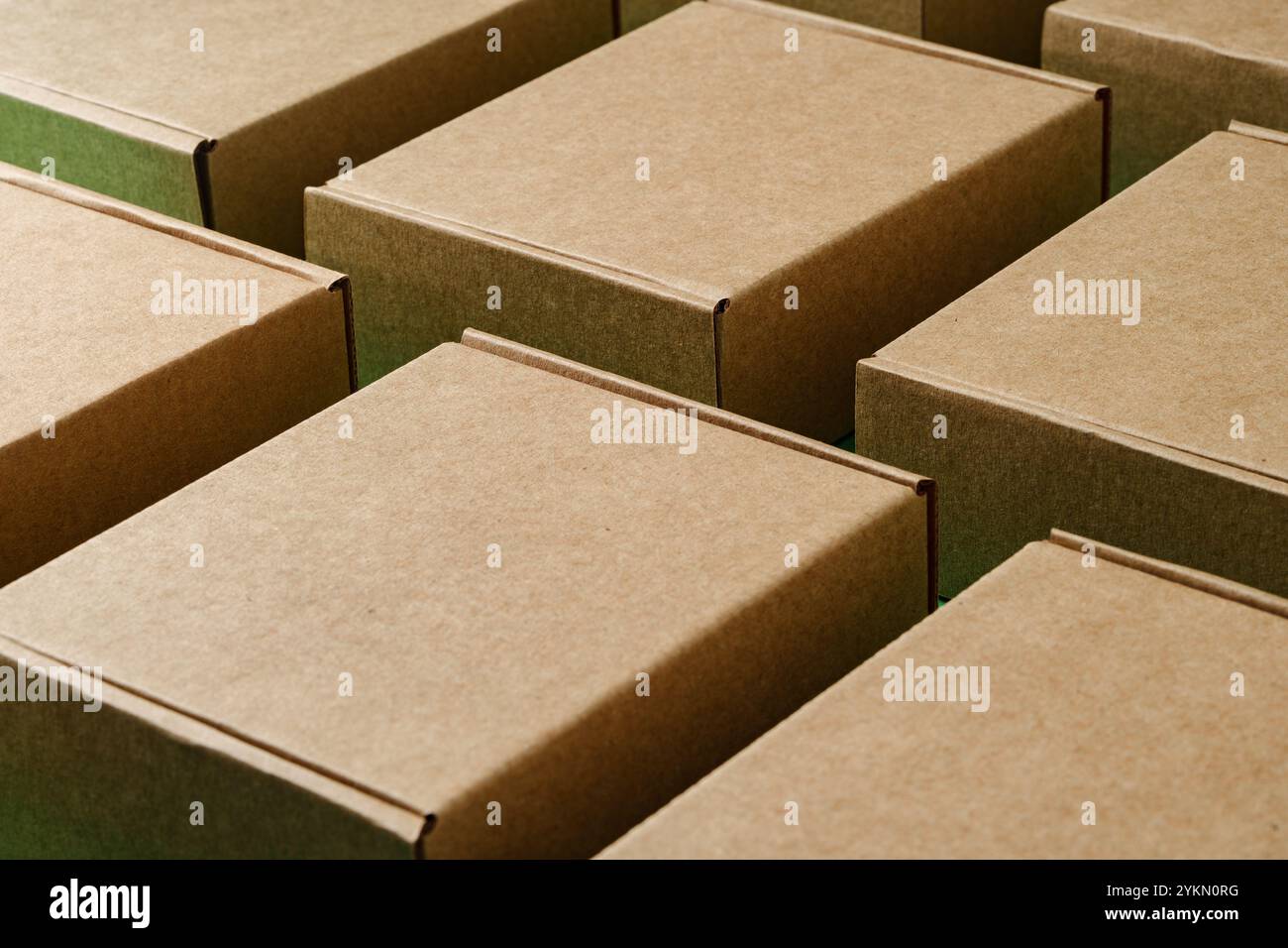 A close view of multiple brown cardboard boxes stacked closely in a ...