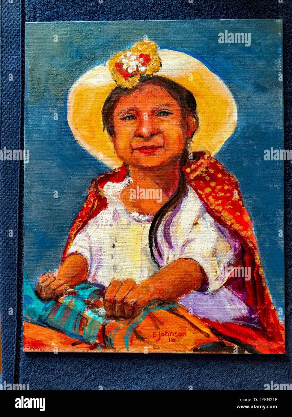 Portrait painting of an indigenous woman wearing a straw hat and ...