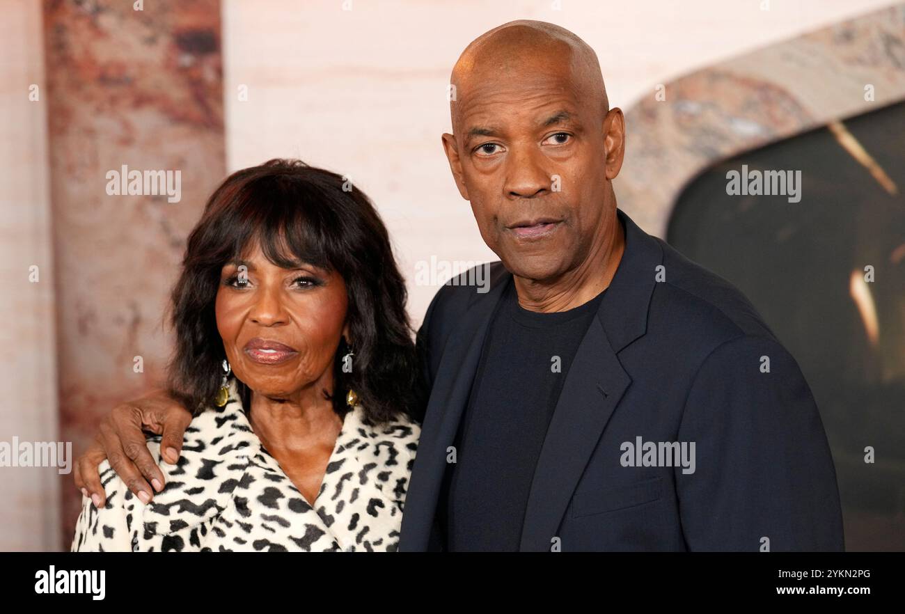 Denzel Washington, right, and his wife Paulette pose together at the ...