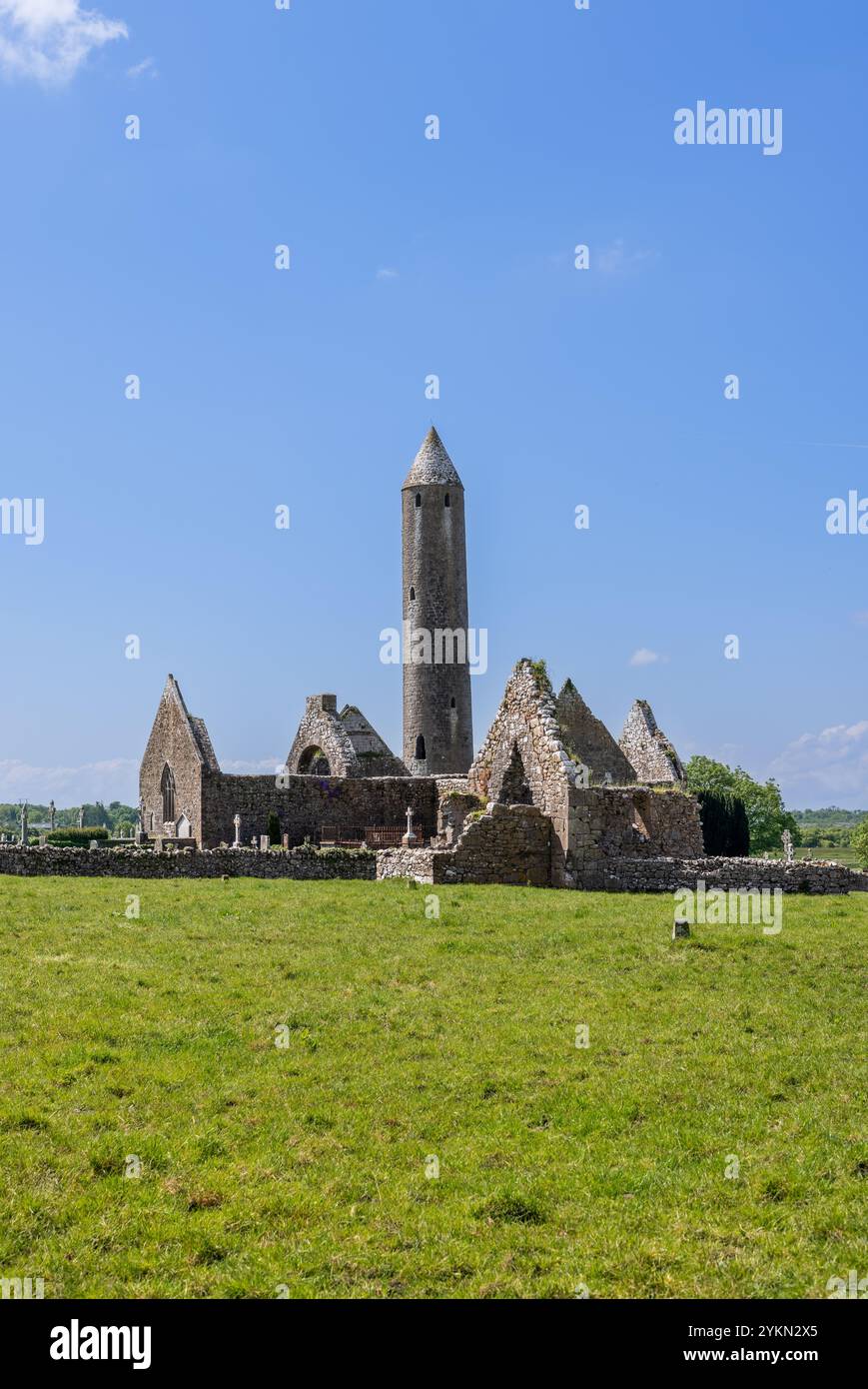 Kilmacduagh Abbey ruins in County Galway, Ireland, showcase a tall ...