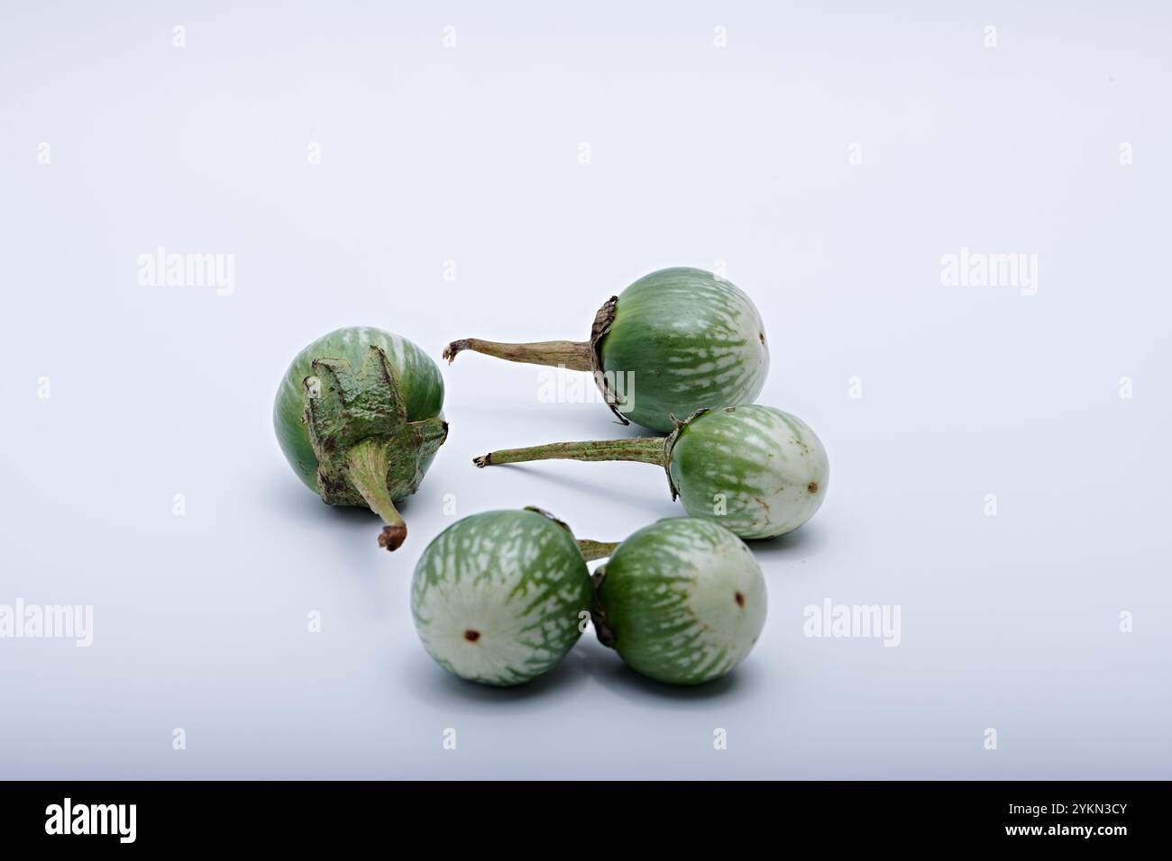 Healthy vegetable green round eggplant photographed on white background ...