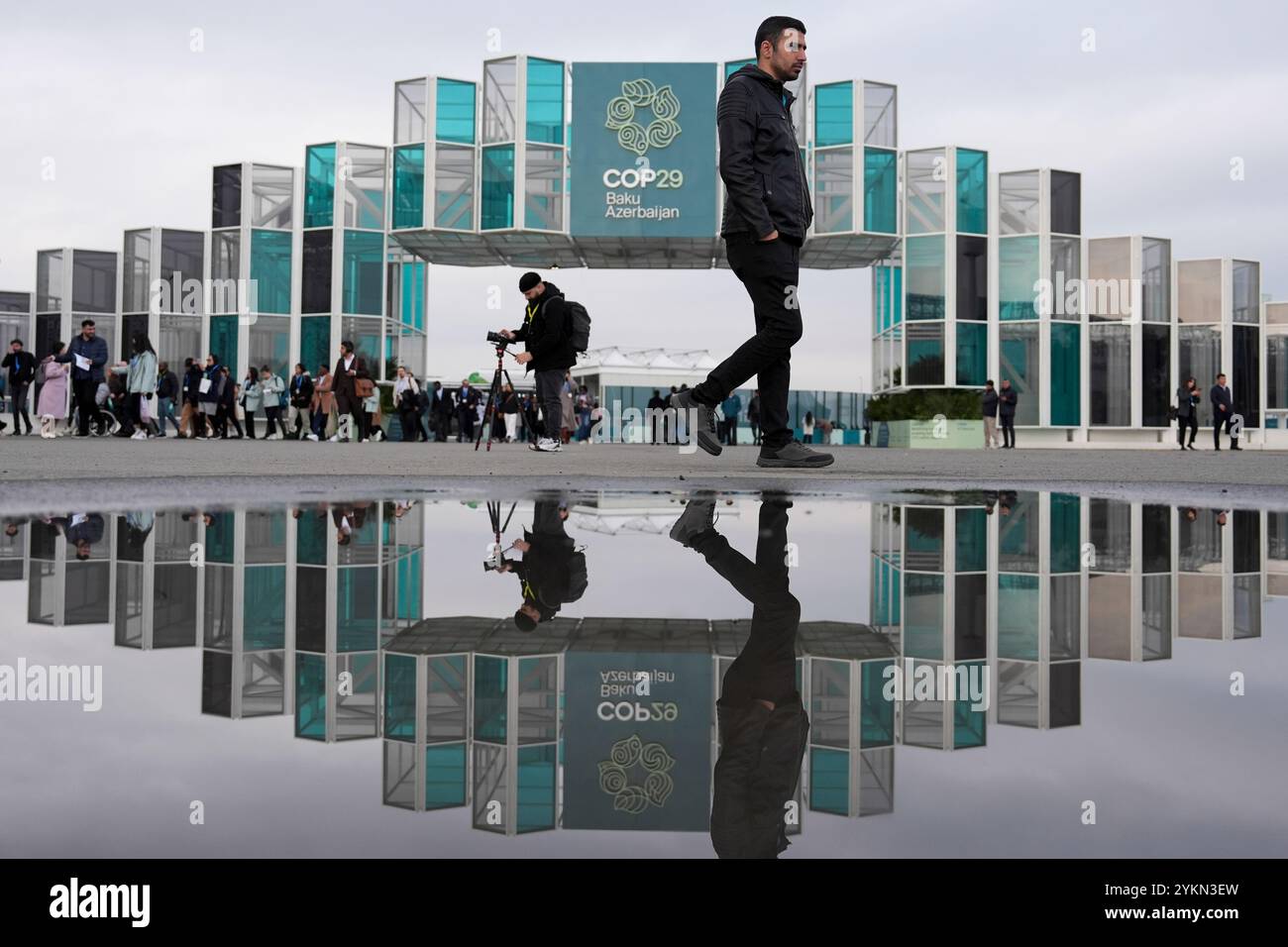 People arrive for the day at the COP29 U.N. Climate Summit, Tuesday ...