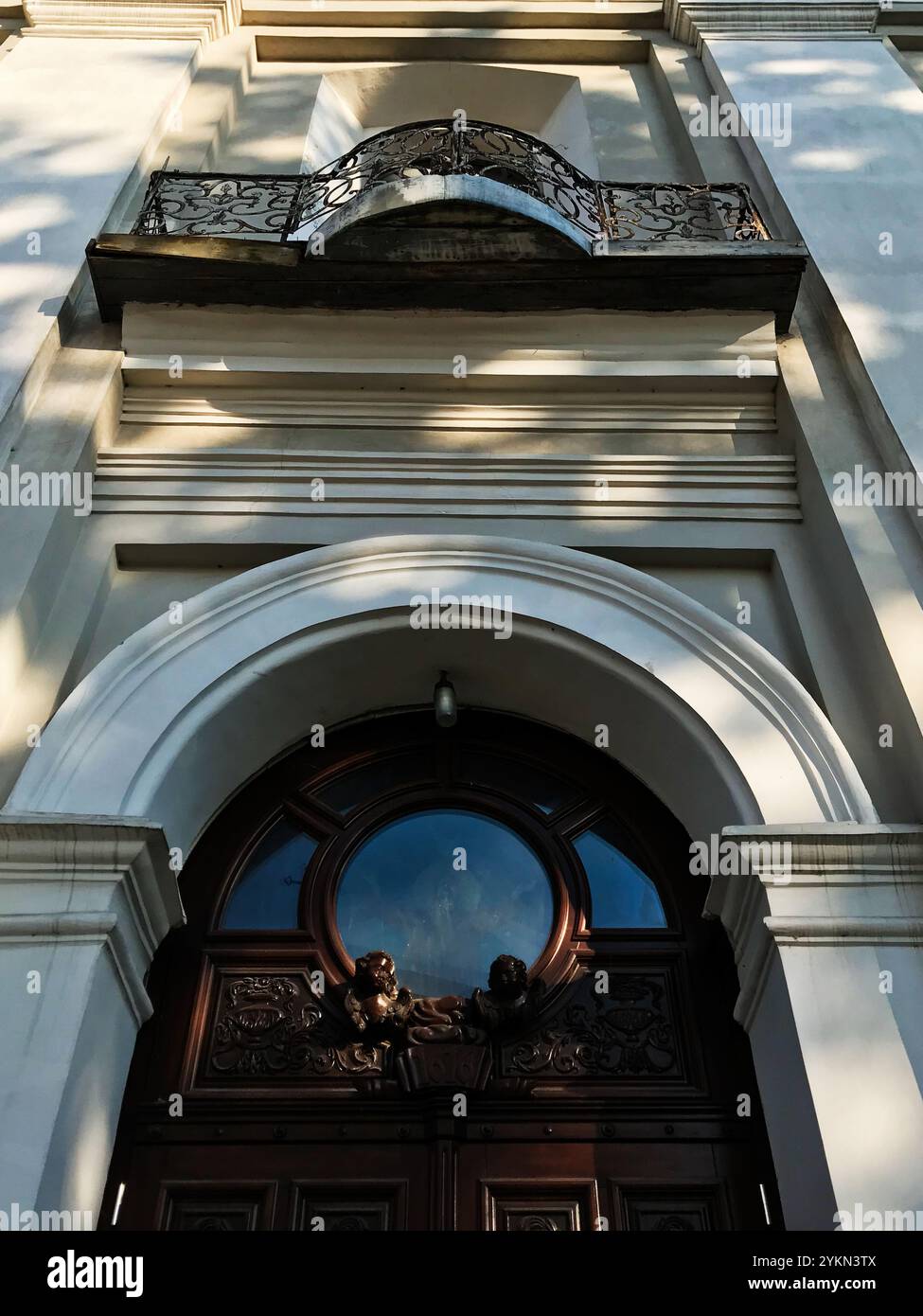A classic architectural doorway featuring intricate carvings and an ...