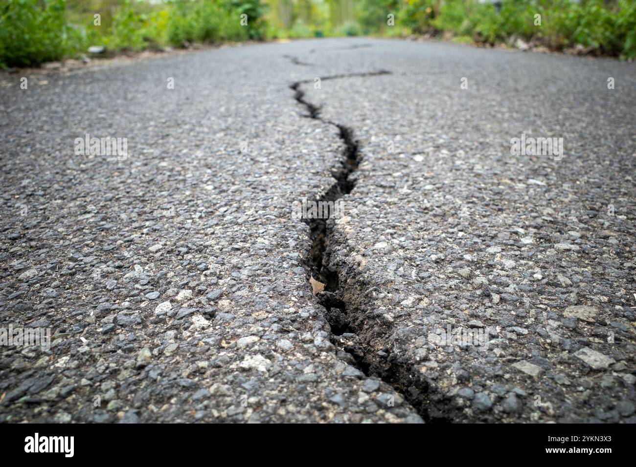 Asphalt cracks, road surface damage due to earthquake in Indonesia ...