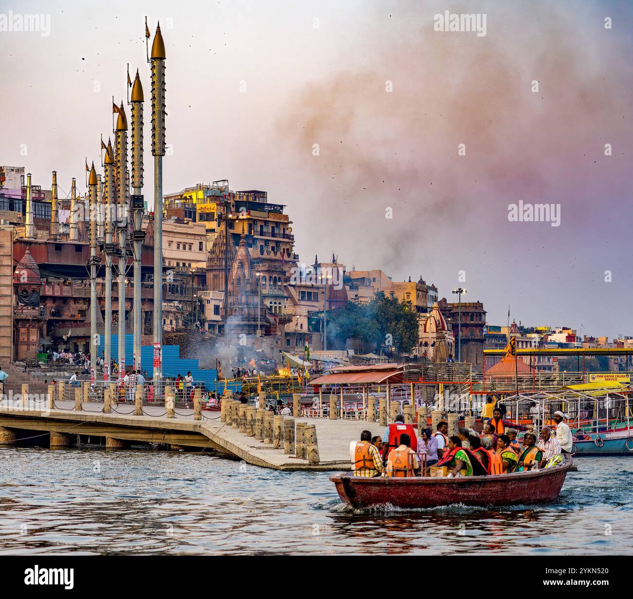 Pilgrims on a boat tour along the ghats of varanasi on the holy river ...
