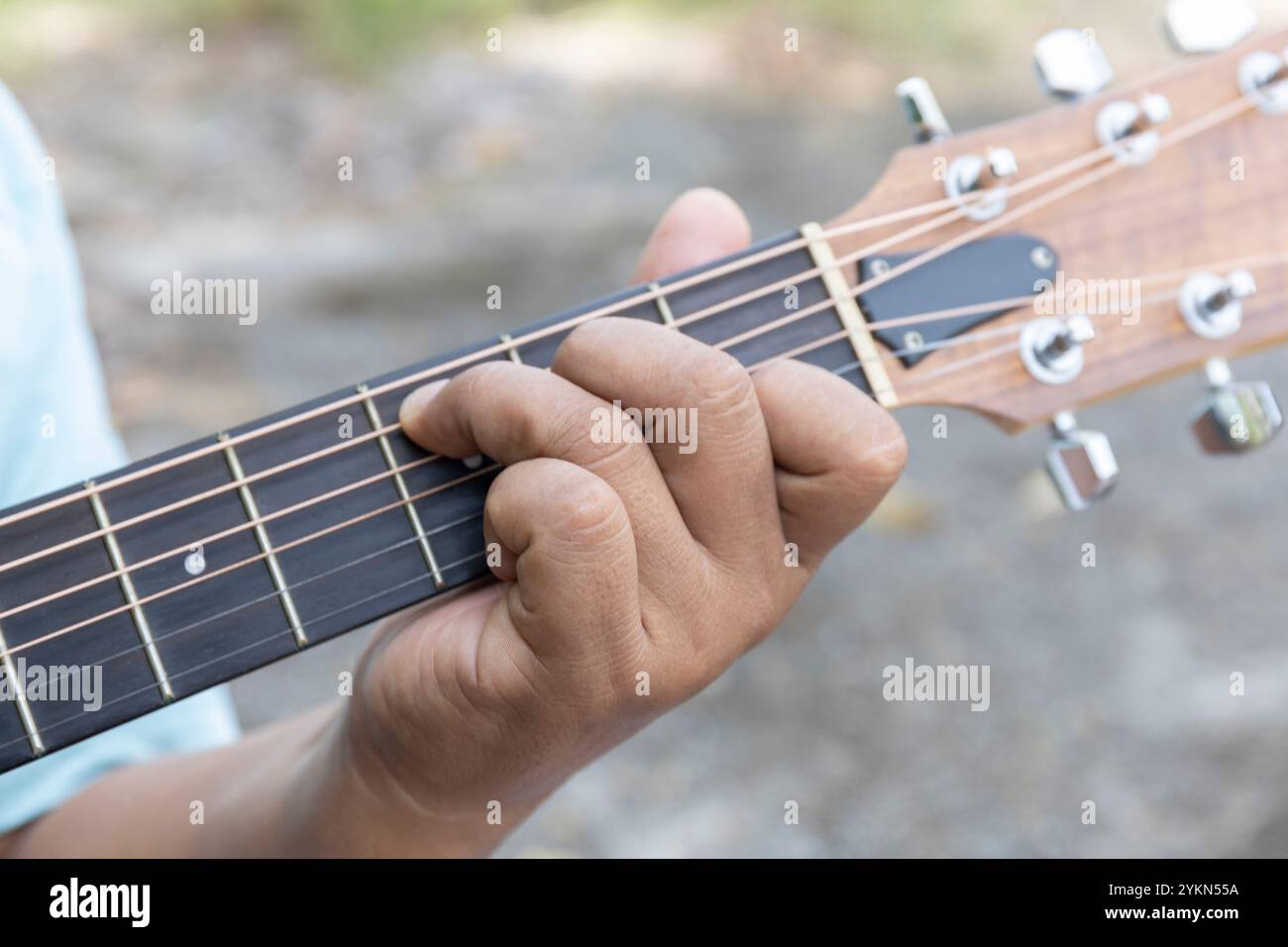 Christian guitar player strums with passion, their fingers crafting a ...