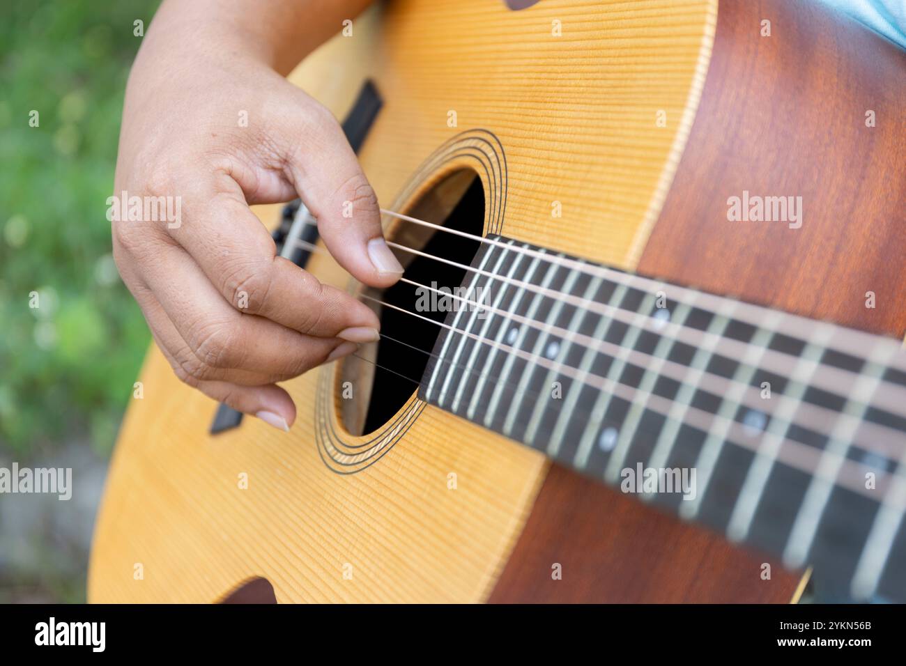 Christian guitar player strums with passion, their fingers crafting a ...