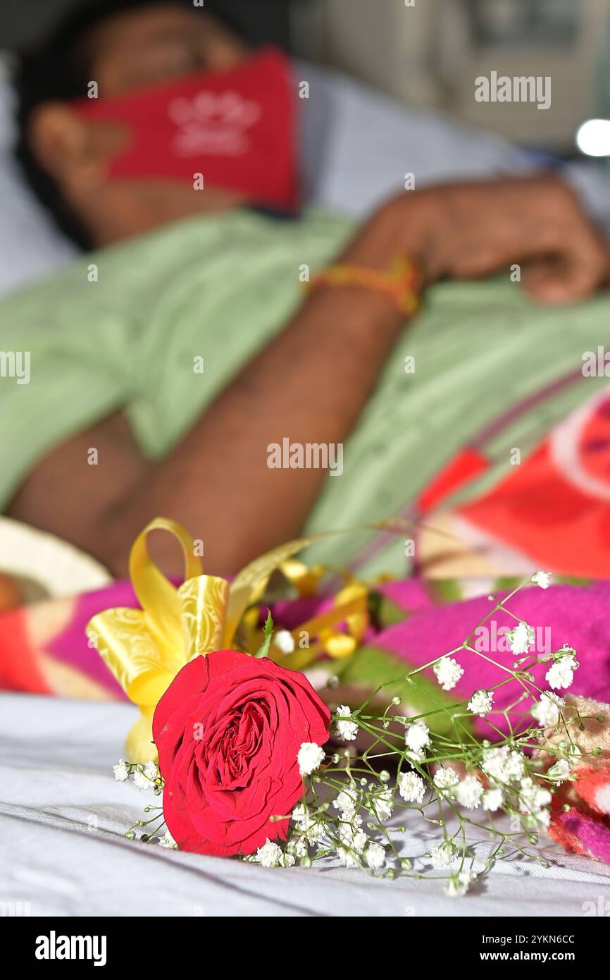 A rose and fruits are distributed to a patient by doctors and health ...